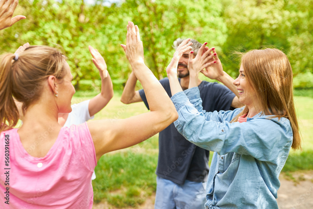Group of young people have fun giving high five Stock Photo | Adobe Stock