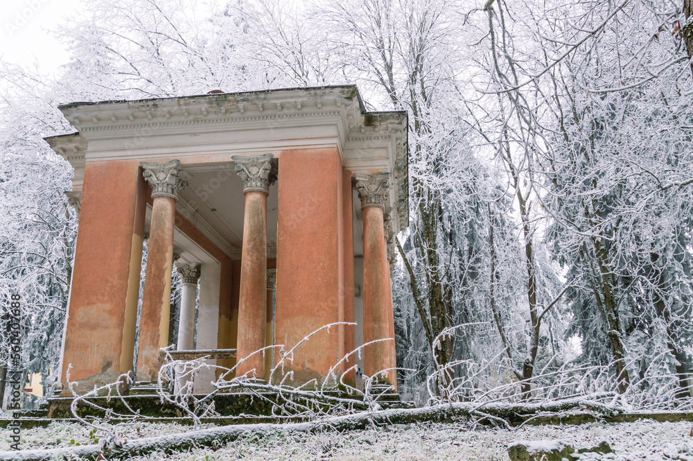An architectural ancient structure with columns and stucco. The ...