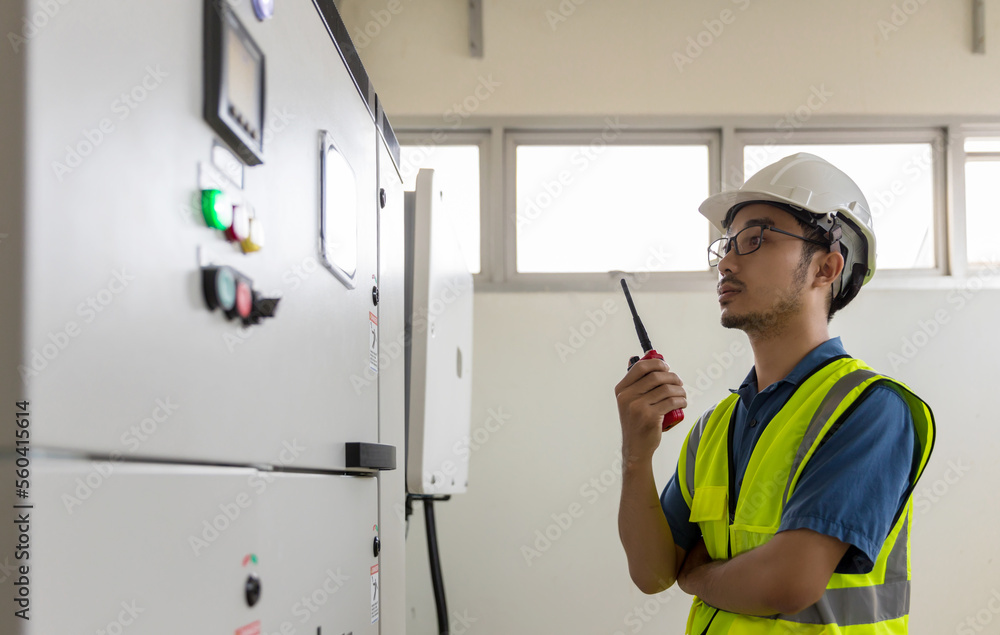 Electrical engineer working in control room. Electrical engineer man ...