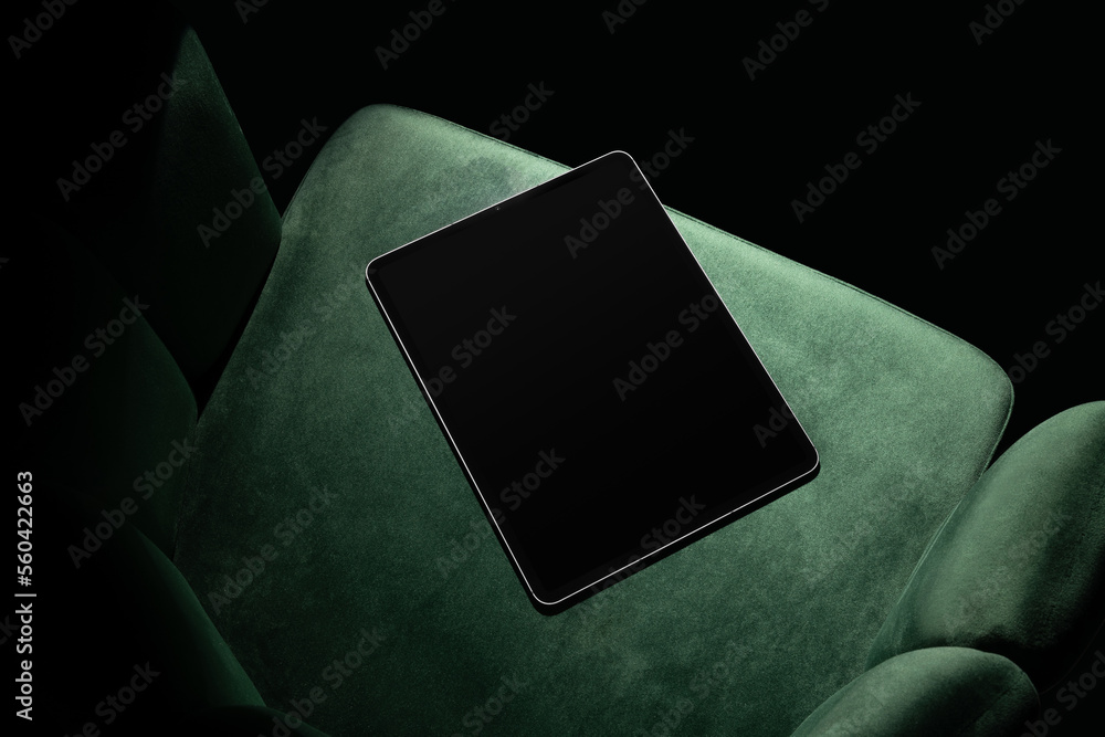 Blank tablet mockup template on a velvet, green art deco furniture ...