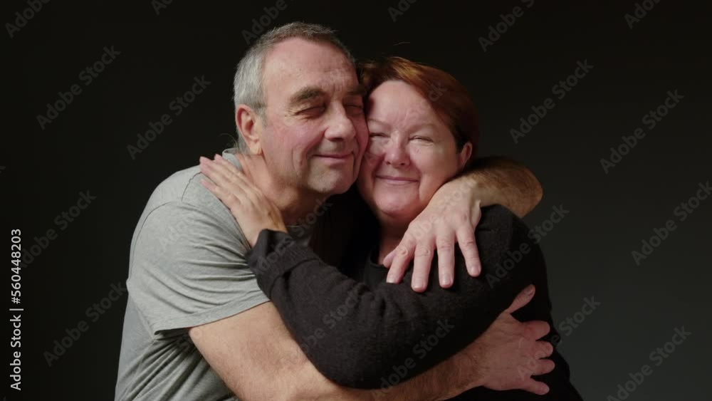 Cheerful old elderly adult family couple hugging laughing bonding ...