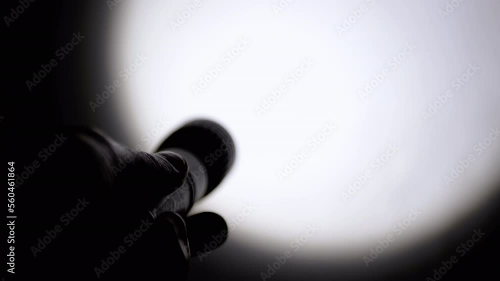 Person Shines a Flickering Flashlight on Wall in a Dark Room ...