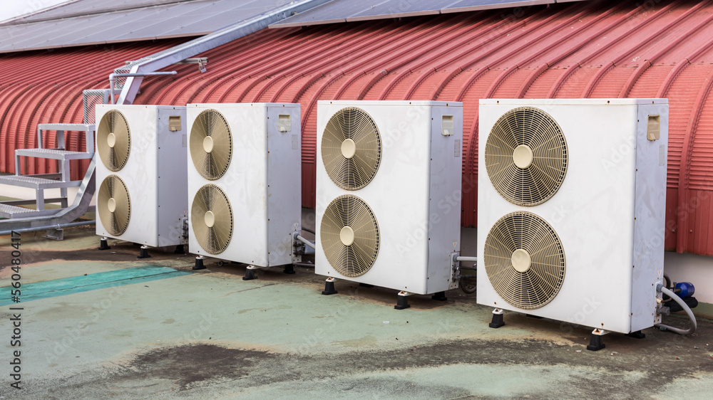 Air conditioner compressor installed in old building. Outdoor split ...