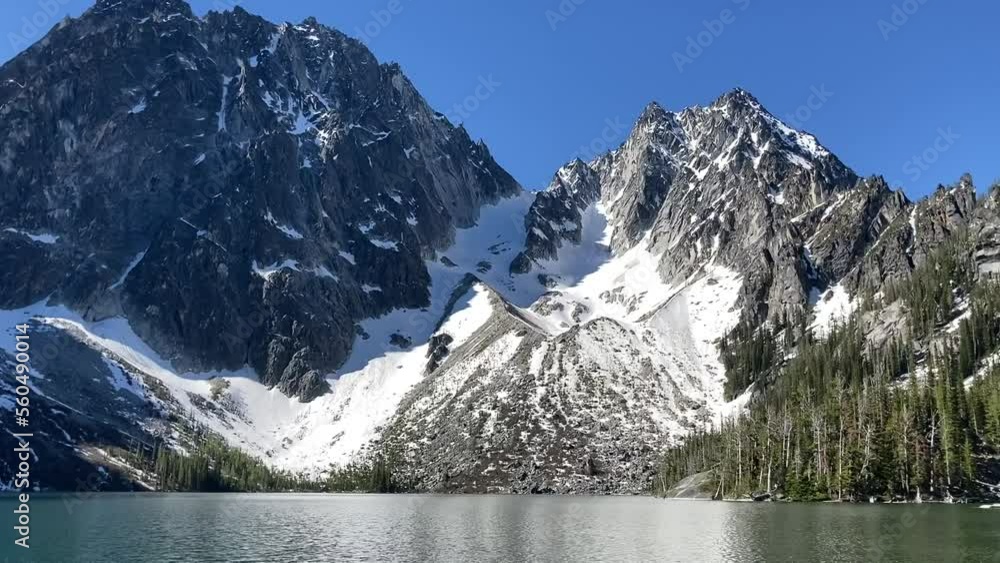 The stunning view of snow-capped Dragontail and Colchuck Peaks and ...