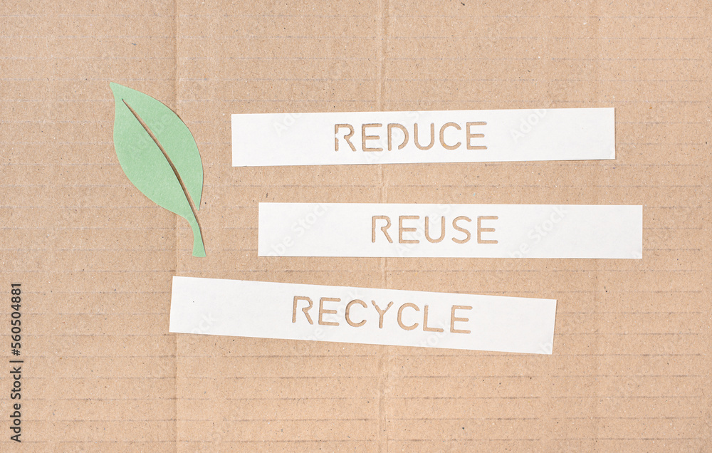 Reduce Reuse Recycle concept. Leaf and Paper strips with cut out text ...