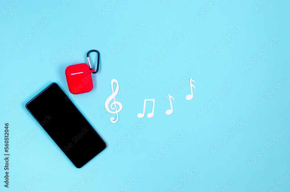 telephone, white wireless earphones with music notes and treble clef ...