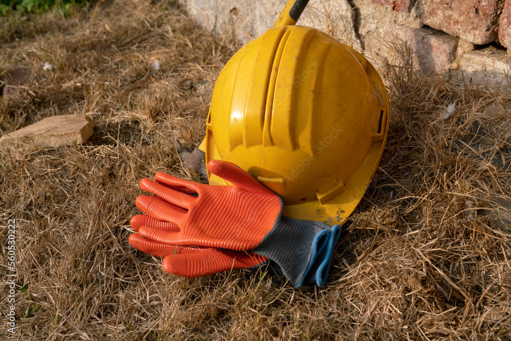 work on construction sites, individual protection of helmet, hammer and ...