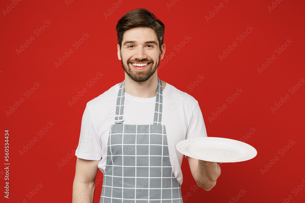 Young waiter smiling happy cheerful male housewife housekeeper chef ...