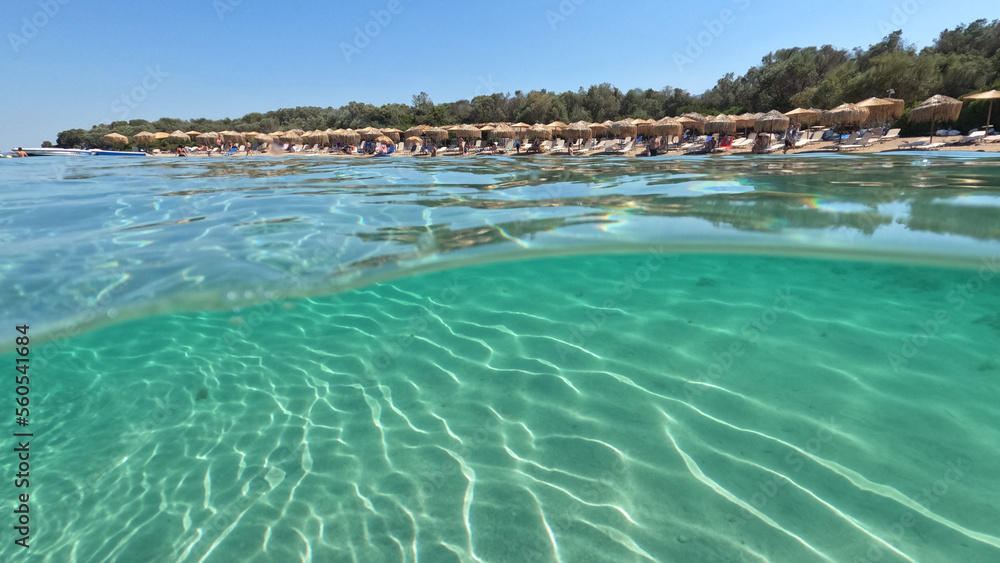 Underwater split photo of famous turquoise beach of Monolia in small ...