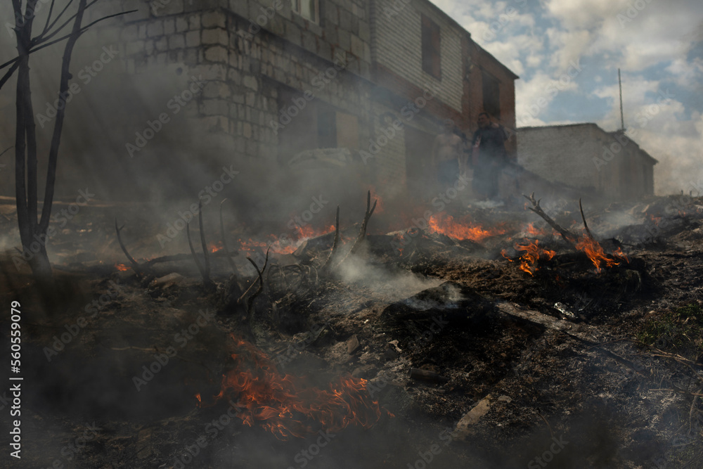 Black smoke from fire. Burning of garbage. Destruction of nature ...