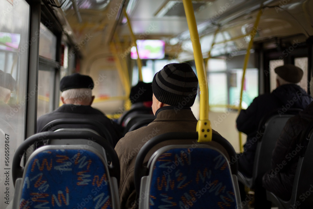 People on bus. Seating on public transport. Seats in interior of bus ...