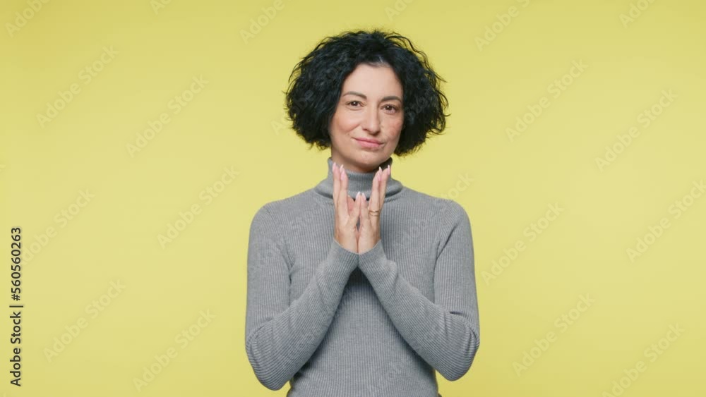 Woman 40s make a plan, smiling mature woman on yellow background ...