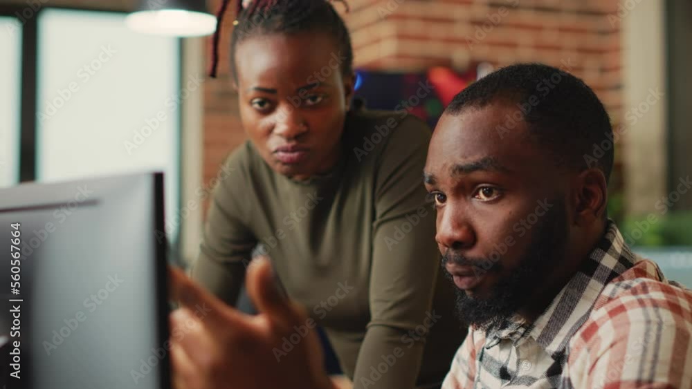 African american team of engineers working with 3d modelling software, brainstorming new ideas ...