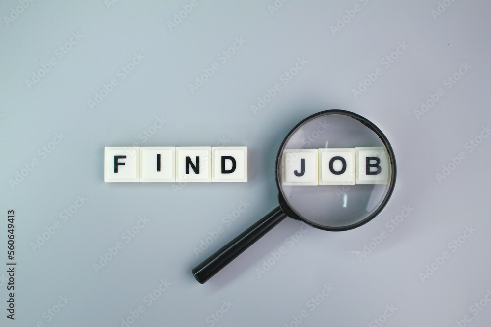 magnifying glass and letters of the alphabet with the word find job ...