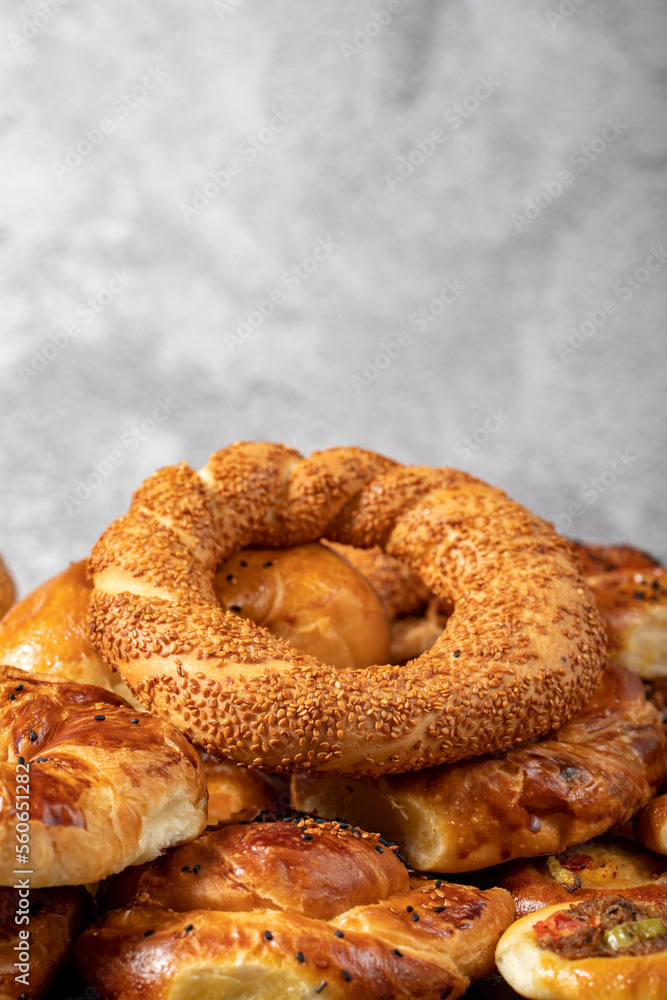Bagel and pogaca varieties. They eat pastries in piles. Bakery products. Traditional turkish ...