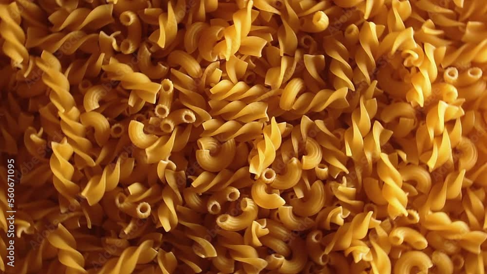 Uncooked Fusilli and Chifferi Rigati Pasta - Top View, Low Key Light ...