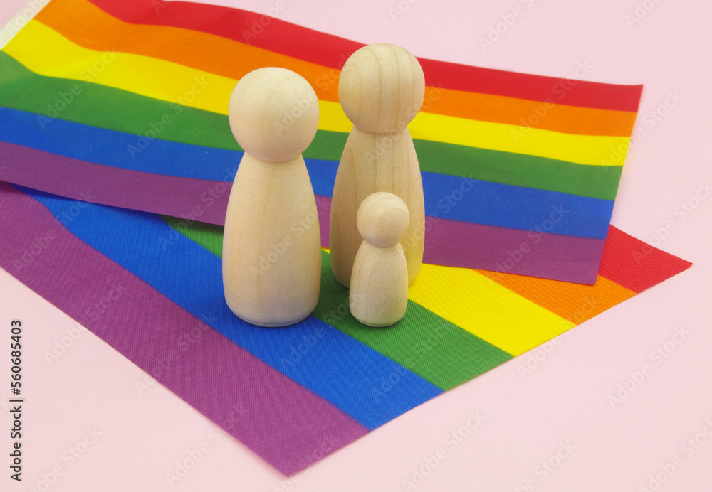 LGBT family concept. Two female people figures and child figure on LGBT ...
