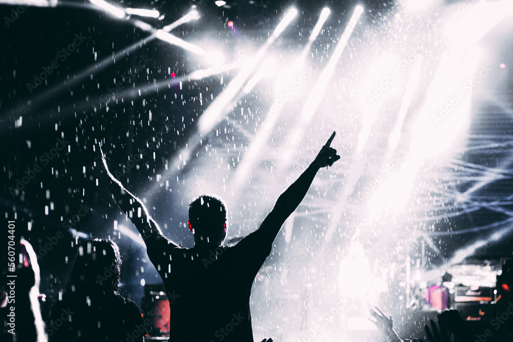 An excited man at the concert ภาพถ่ายสต็อก | Adobe Stock