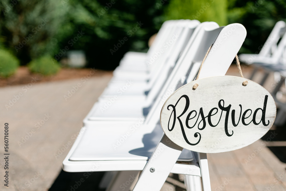 Reserved Sign Hanging off of Ceremony Chair Stock Photo | Adobe Stock
