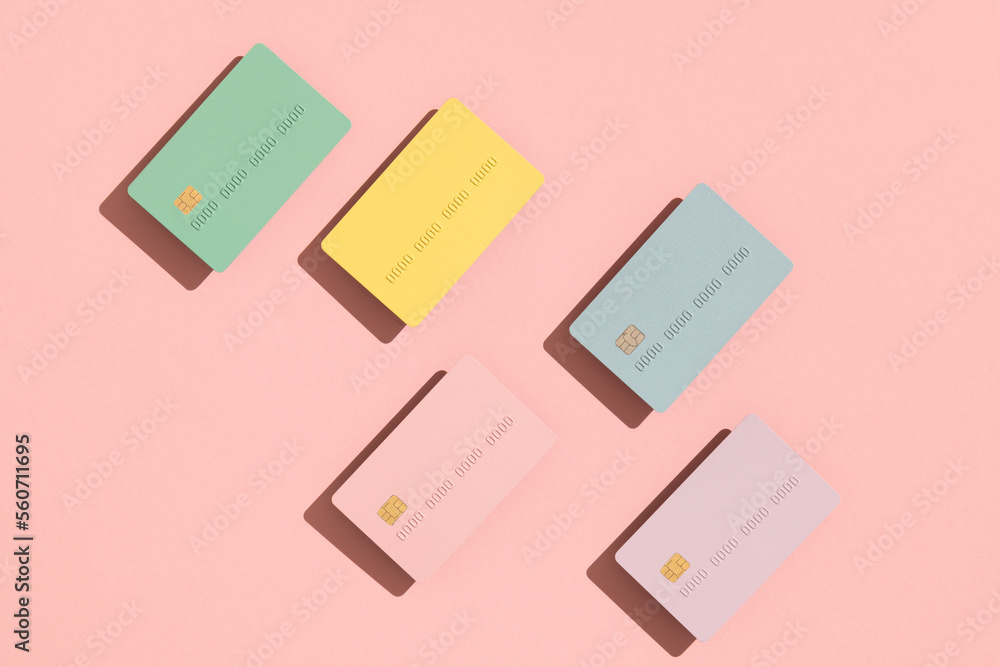 Pastel credit / debit cards on pink background Stock Photo | Adobe Stock