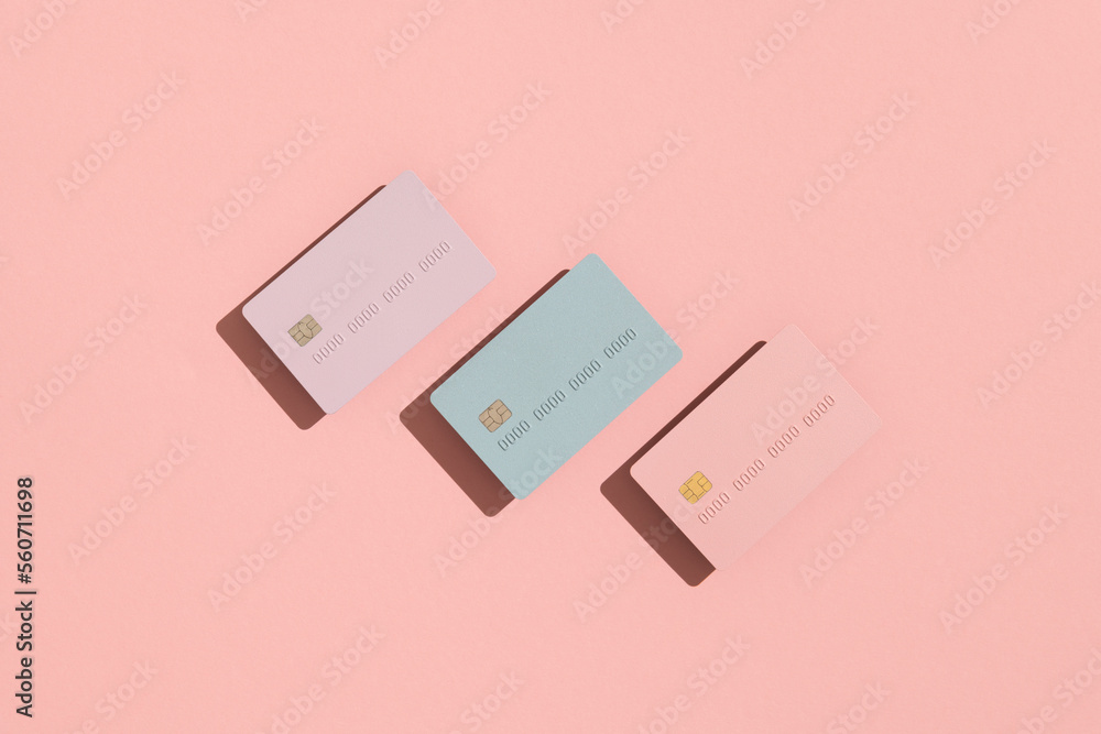 Pastel credit / debit cards on pink background Stock Photo | Adobe Stock