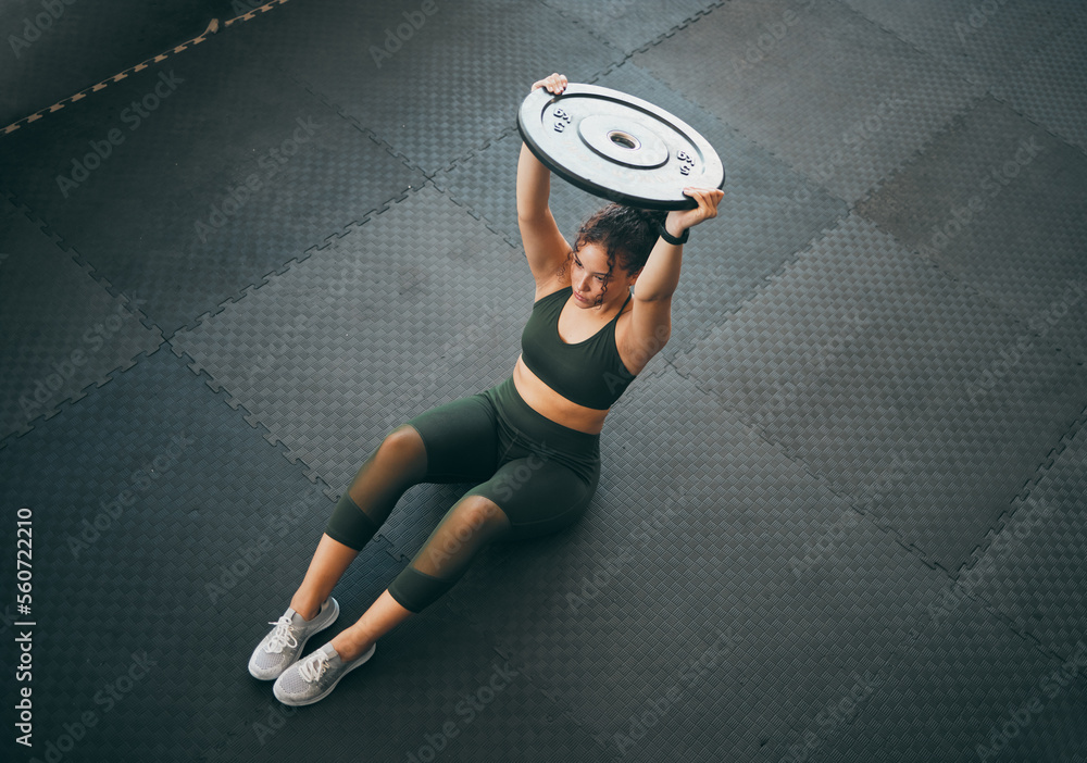 Fitness, weight plate and woman at gym for workout, exercise and ...