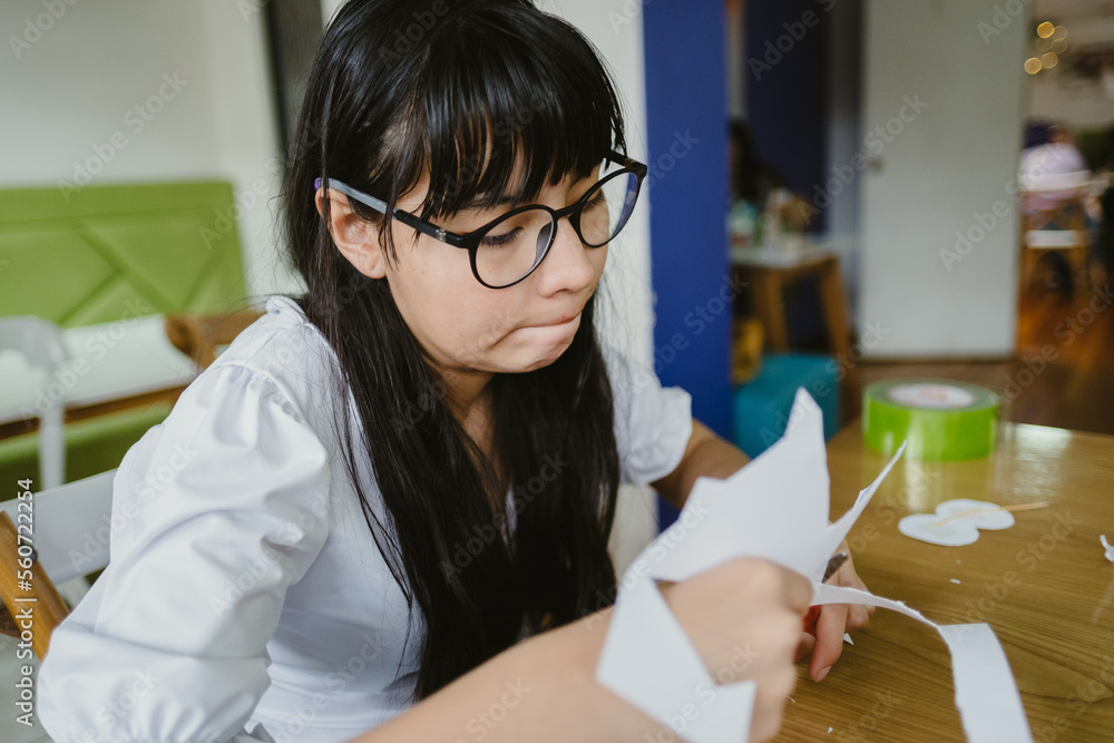 cute young girl making handicrafts Stock Photo | Adobe Stock