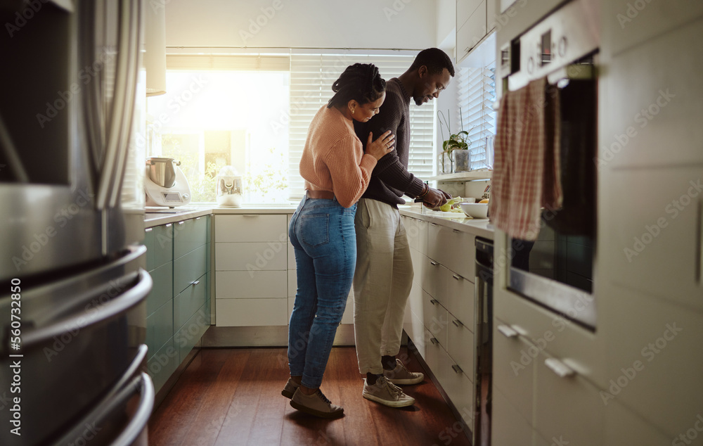 Black couple, cooking and food in kitchen at home while together to ...