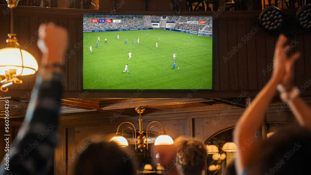Group of Soccer Fans Watching a Live Football Match Broadcast in a ...