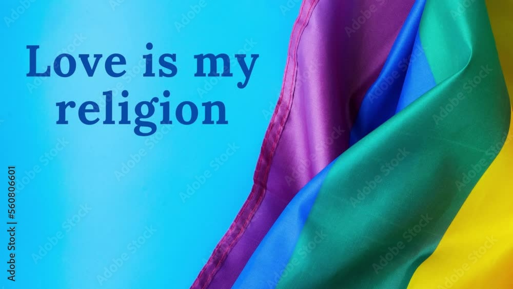 4k zoom in out Rainbow flag with text LOVE IS MY RELIGION message ...