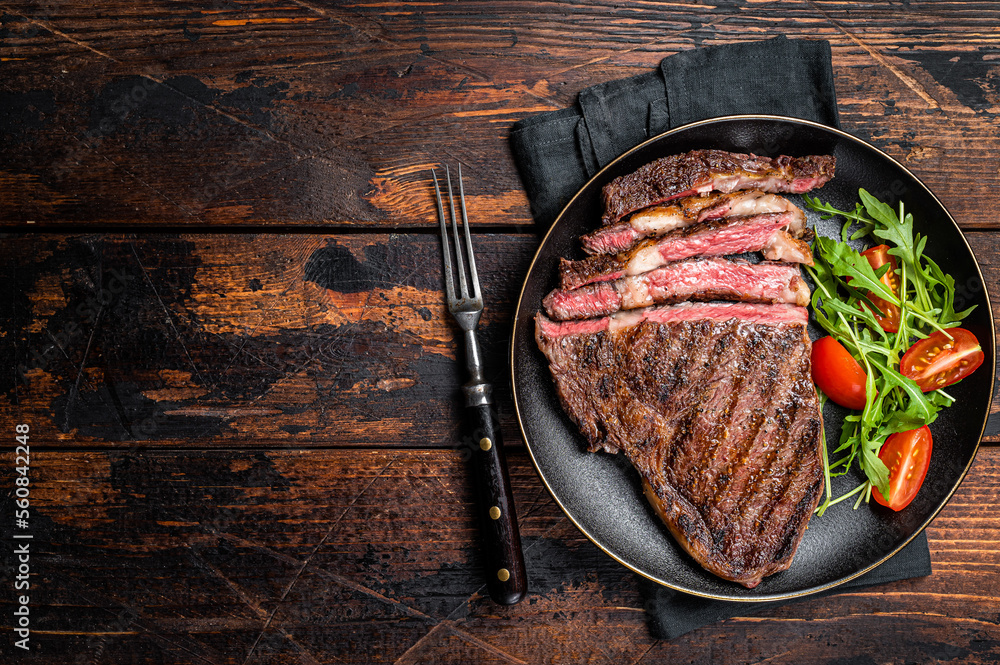 Barbecue grilled and sliced wagyu Rib Eye beef meat steak on a plate ...