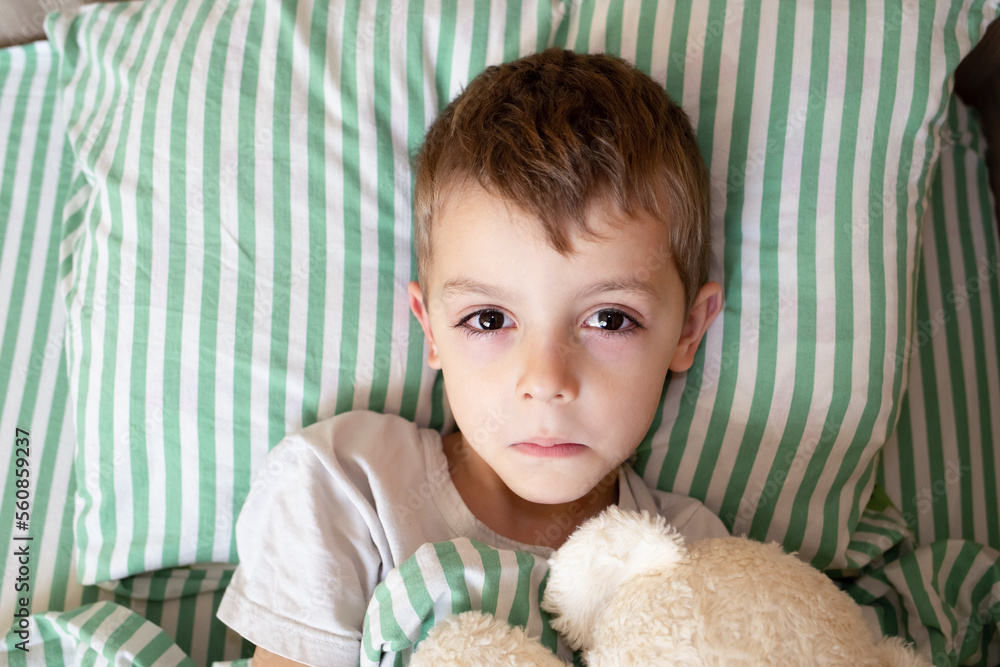 Unhealthy little boy child sleep in bed relax at home in bedroom. Sick ...