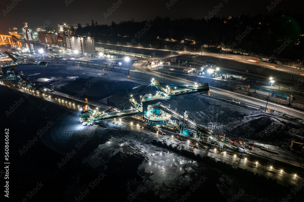 Rotary shovel at coal pile, bulk shipping terminal, silos, grain ...