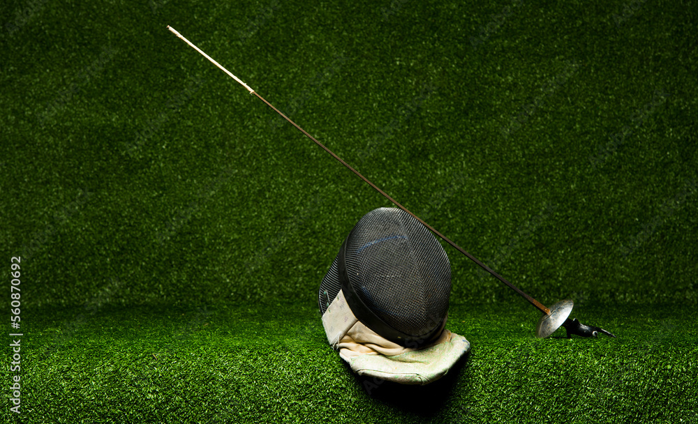 helmet and rapier for fencing on a green background Stock Photo | Adobe ...