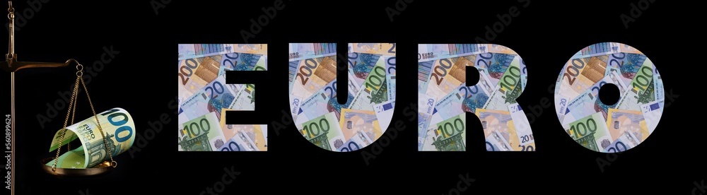 Scales with a banknote of 100 euros and the word EURO on a black ...