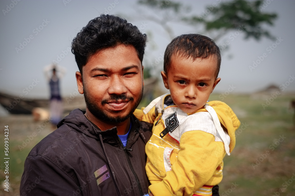 South asian family photo, asian young father holding his son in outdoor ...