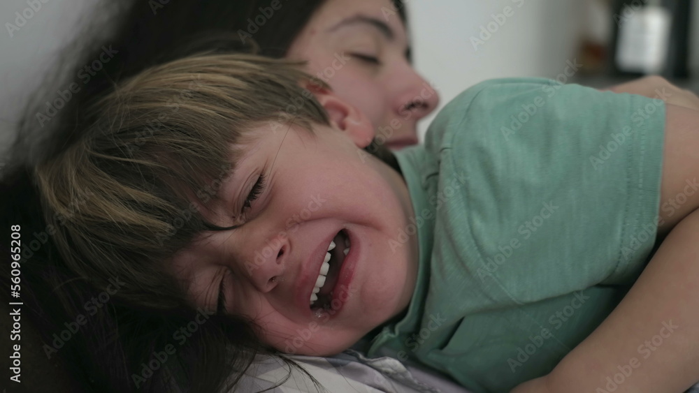 Tearful crying child. Mother consoling sad little boy. Kid in crisis ...