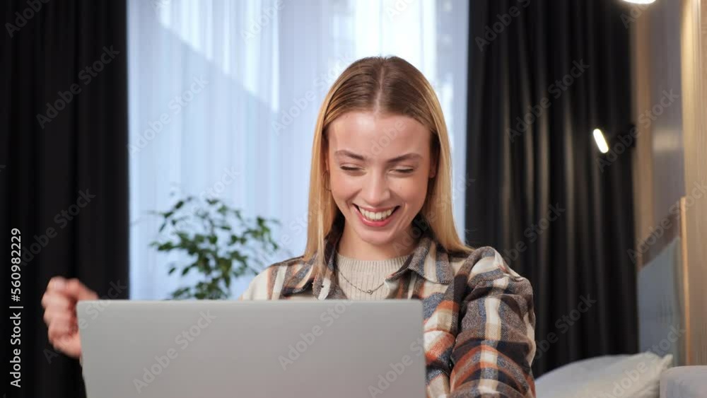 Happy pretty blonde girl smiling face waving hand talking to webcam ...