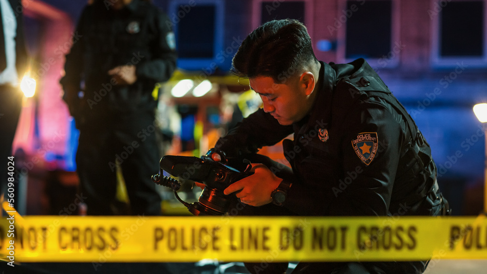 Policeman Checking Camera after Taking Forensic Photos of Evidence ...