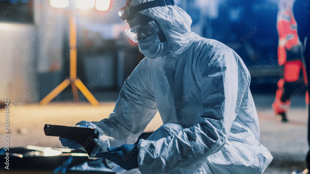 Forensics Specialist Putting the Murder Weapon in an Evidence Bag to Be ...