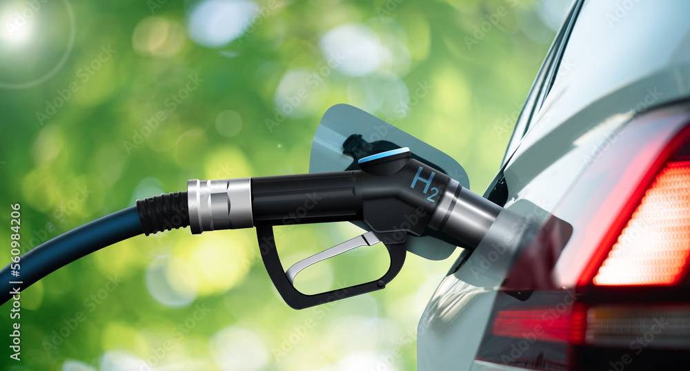 Close up of fuel cell car with connected hydrogen fueling nozzle on a ...