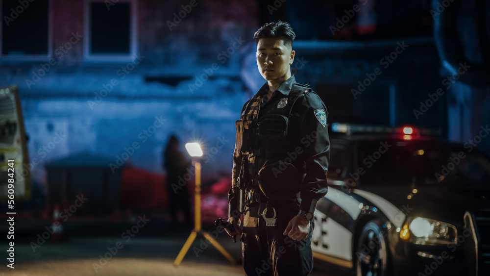 Wide Portrait Shot of a Young Asian Police Officer Holding a Flashlight ...