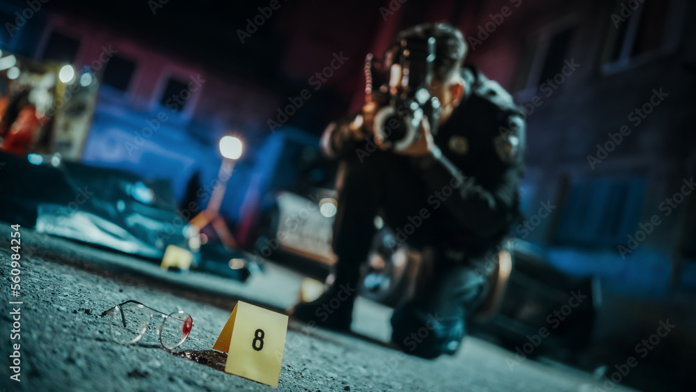 Policeman Taking Photos of Marked Evidence on a Crime Scene at Night ...