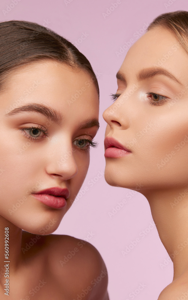 Youth perfection. Portrait of two young, beautiful girls with well-kept ...