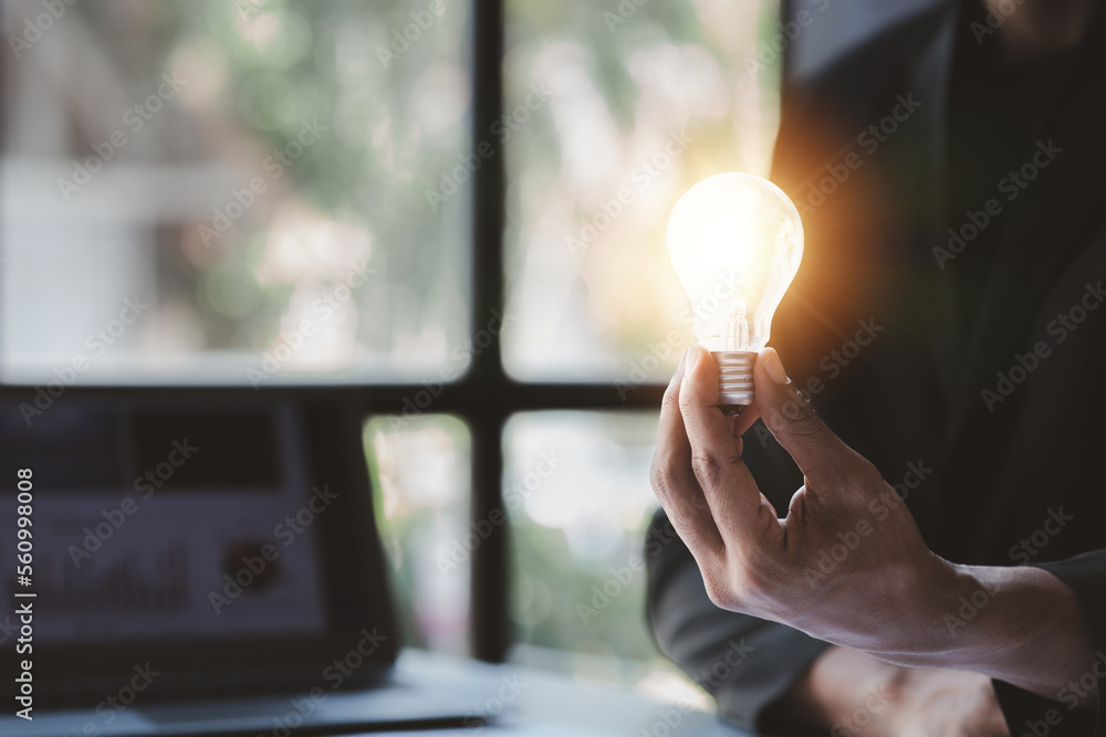Foto de Man hold glowing light bulb, Creative new idea. Innovation ...
