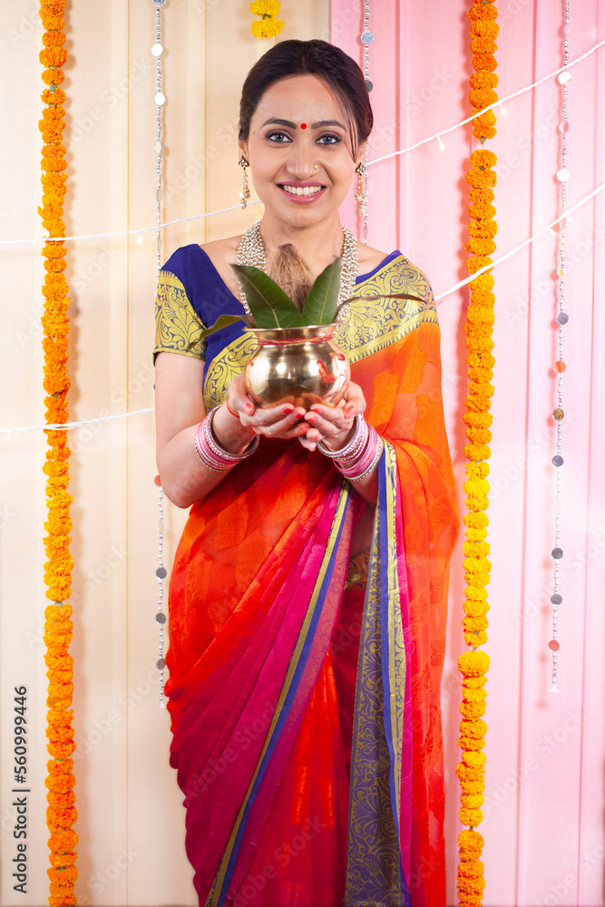 Photo & Art Print Indian woman with traditional copper Kalash - Puja ...