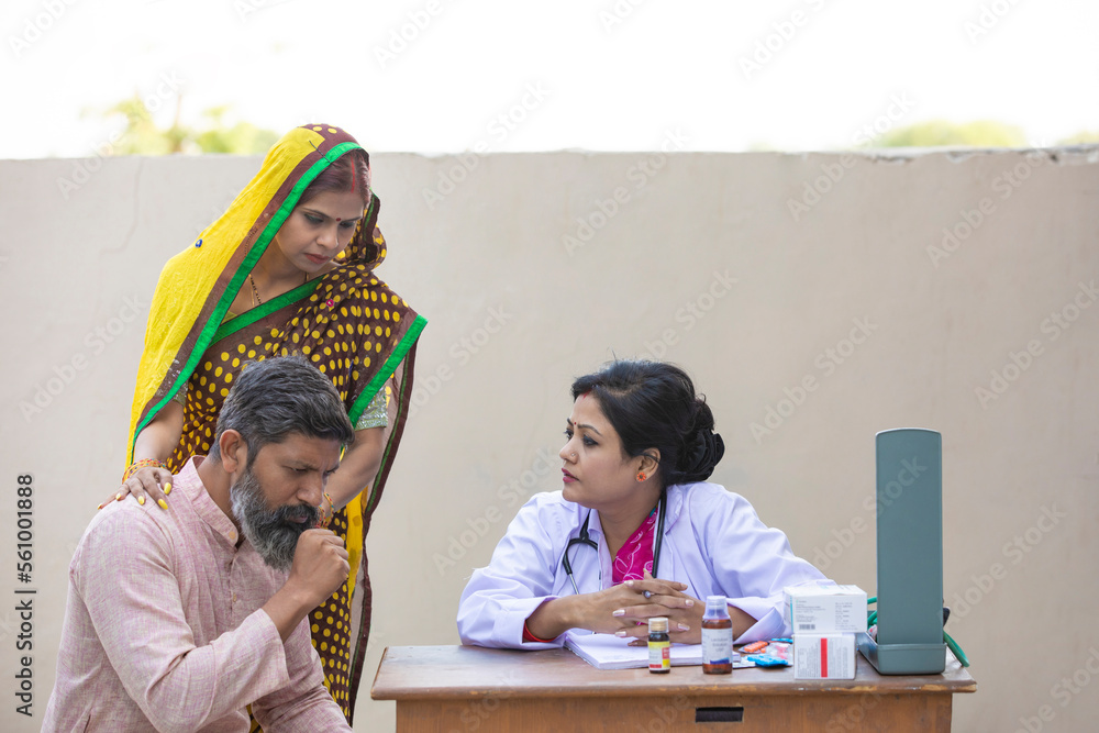 Indian woman doctor counseling to rural couple at clinic. Stock Photo ...