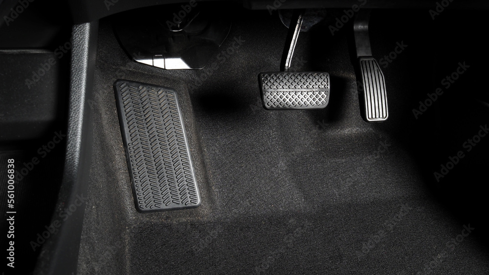 Foto de Car accelerate and brake foot pedal. Close up foot press or ...