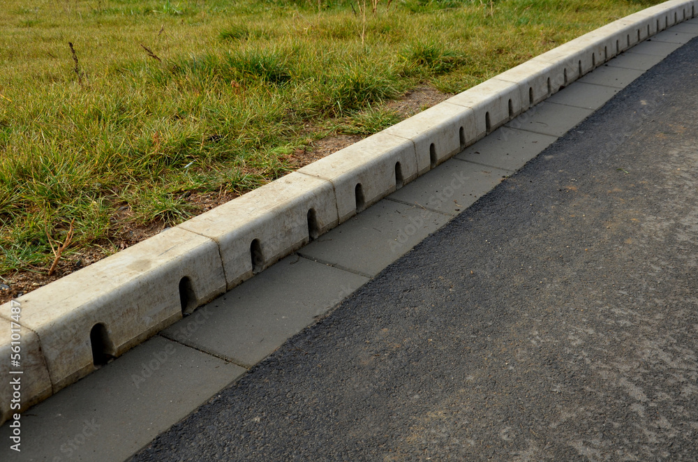 drainage hidden on the edge of an asphalt road Drainage system hidden ...