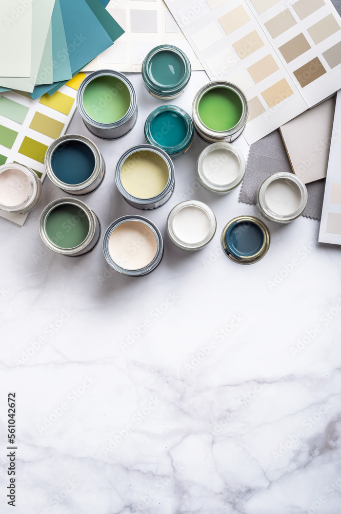 Tiny sample paint cans during house renovation, process of choosing ...
